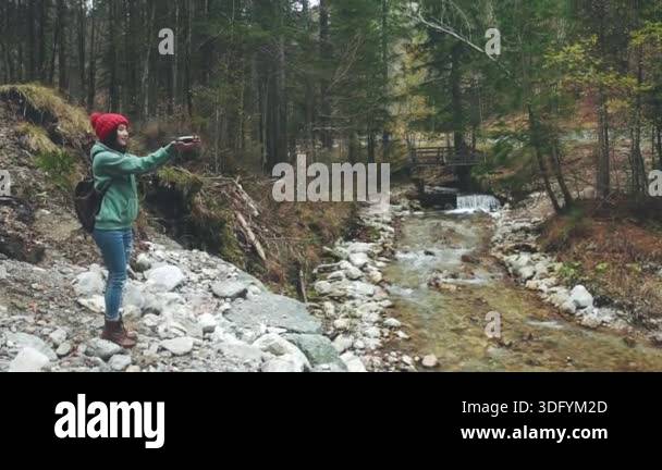 Portrait of girl launching drone or quadrocopter. Drone rising with ...
