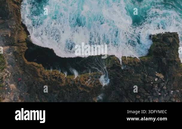 Aerial view of tropical rocky islands and waves. Devils tear lagoon ...