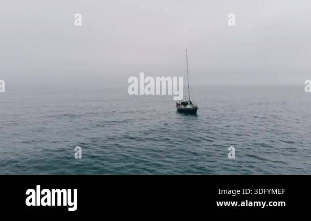 Aerial view of small ship in sea or ocean, struggling with waves, in ...