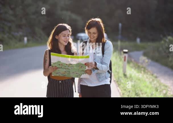 Women smiling and talking about places they want to visit. Girls are ...