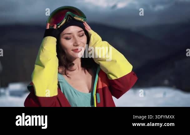 Portrait of cute snowboarder girl smiling Stock Video Footage - Alamy