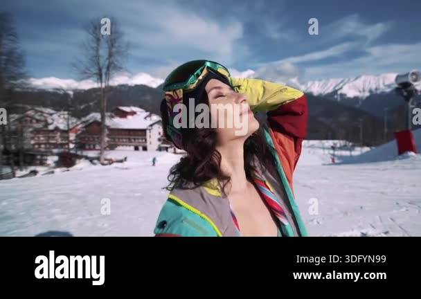 Portrait of cute snowboarder girl smiling Stock Video Footage - Alamy