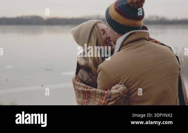 Young couple in love nearby autumn lake. Love, relationship, family ...