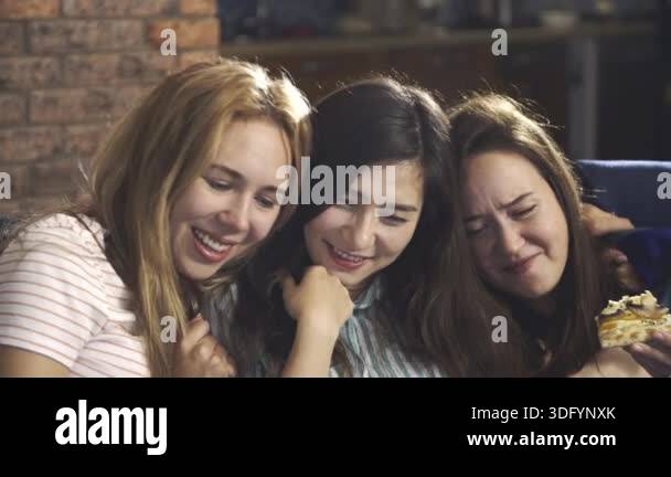 The concept spending time at home together. Charming women friends ...