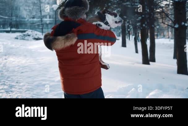 Close up of young bearded man hugging and gently whirling his cute ...