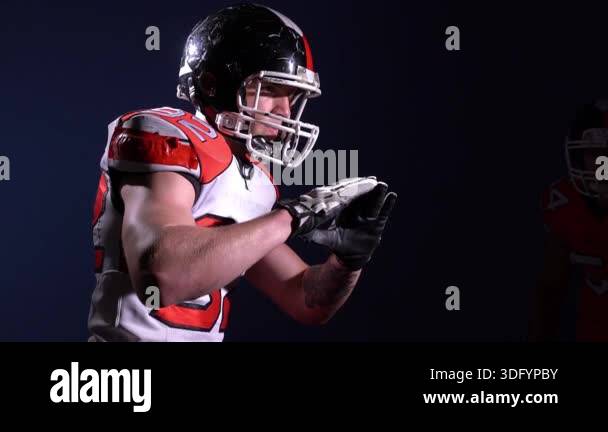 Two american football players fighting while game match. One footballer ...