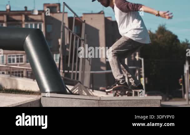 Skateboarder practice. Jump on skateboard in the air. Urban leisure ...