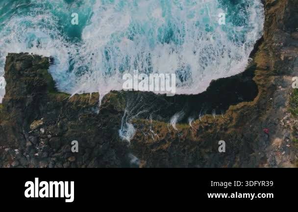 Aerial view of tropical rocky islands and waves. Devils tear lagoon ...