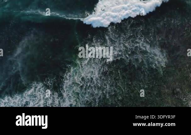 Top down view of fantastic tropical sea tide on coastline. Drone shot ...