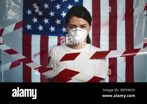 Pandemic, portrait of a young asian woman wearing protective mask ...