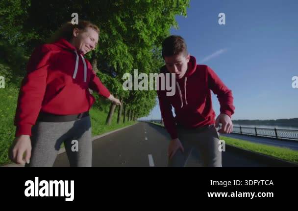 Close-up portrait of friends doing sports outdoors together. Playing ...