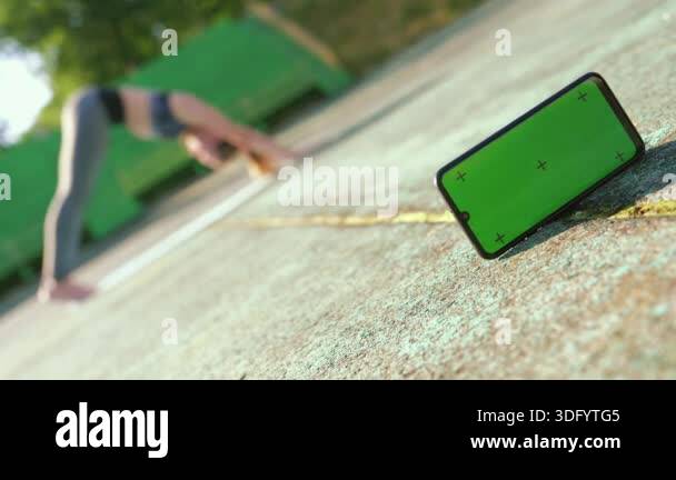 Meditation and relaxation. In foreground is horizontal green screen or ...