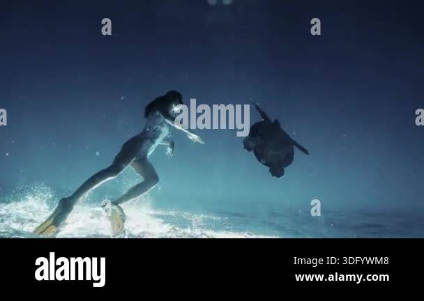 Green tropical turtle swimming with girl in clear blue sea. Beautiful ...