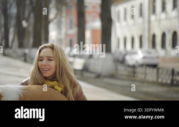 Close up of ginger border collie dog and his owner training outside the ...
