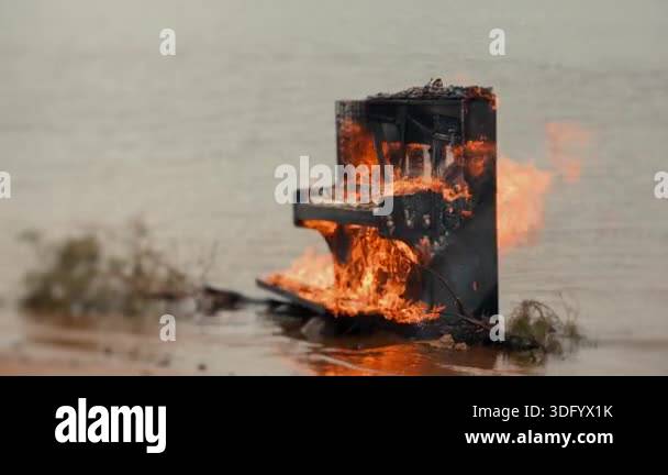 Musicial keyboard instrument piano in fire and smoke. Inferno fire ...