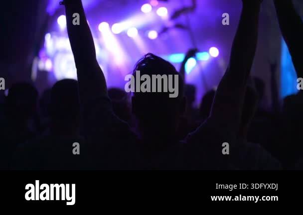 People clapping their hands and singing songs. Silhouette of a girl ...