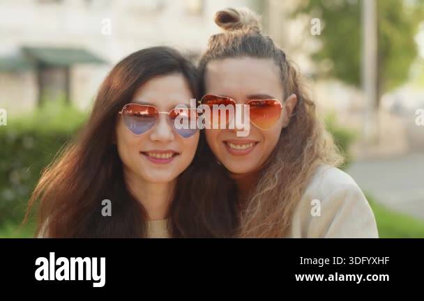 Best friends girls hug, smile and show positive face emotions. Portrait ...