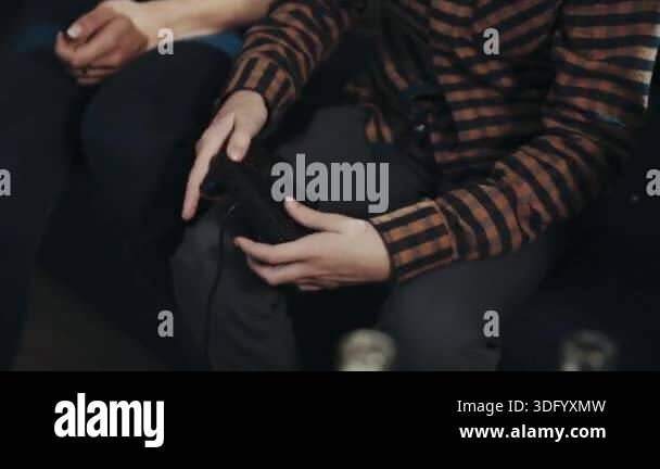 Close-up of happy parents sitting on the sofa with their son playing ...