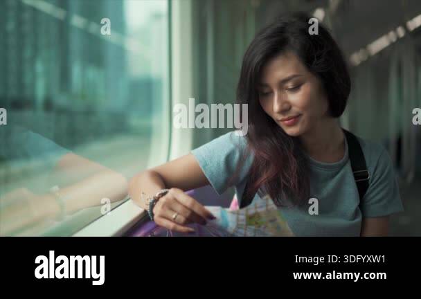 Cute asian woman travel by sky train in Thailand undeground. Teen girl ...