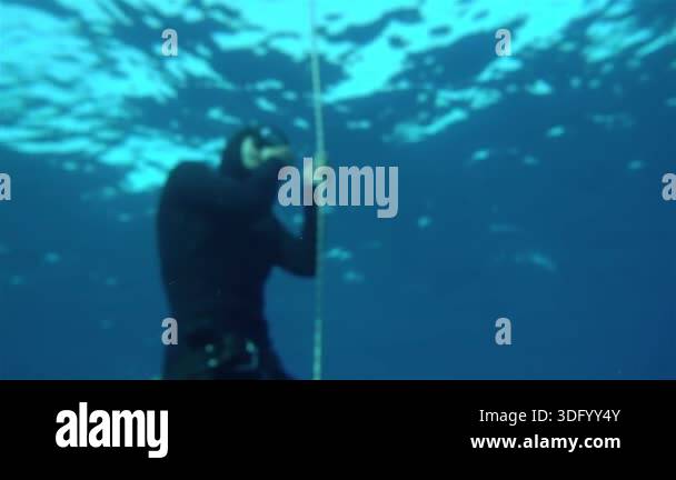 free diver trying to blast ears, defocus to focus. Freediving is a ...