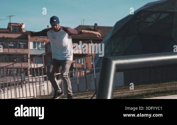 Skateboarder sliding down the stairs falling to the ground. The young ...