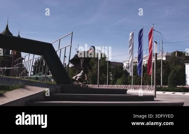 Man in comfortable clothes riding skateboard in the city. Urban ...