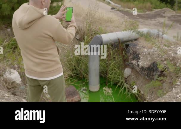 Close up of male ecologist activist got trough forbidden territory and ...