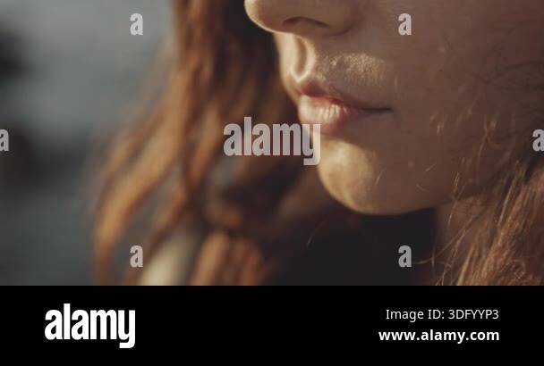 Macro of sad young female face, filmed on cinema camera, 12 bit color ...