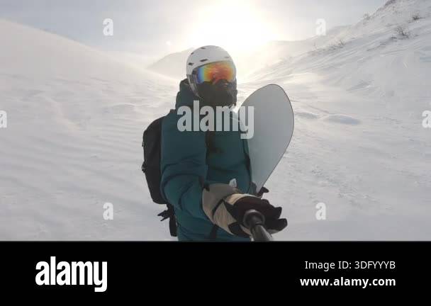 Concept of expedition, travel, sport, weather. Person filming ...