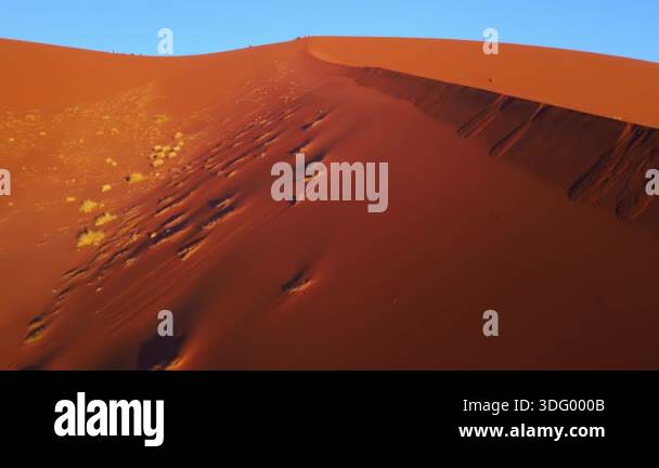 Drone shot from close distance to dazzling sand dune. Aerial view of ...