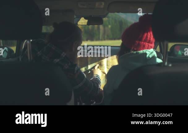 Travelling by car after pandemic. Cute hipster couple of young ...