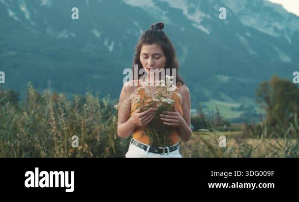 Girl tourist standing on cliff at seaside. The mood of cinematography ...