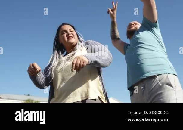 Music and copy space concept. man with tattoo and a woman with dreads ...