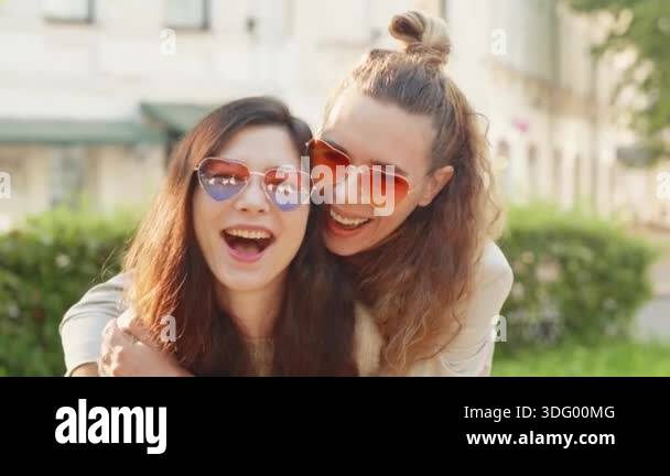 Best friends girls hug, smile and show positive face emotions. Portrait ...