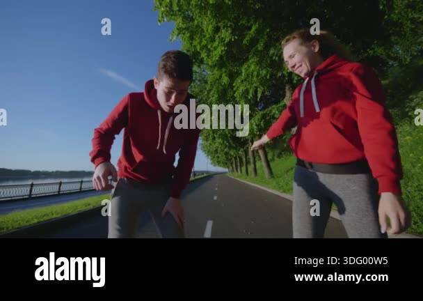 Close-up portrait of friends doing sports outdoors together. Playing ...