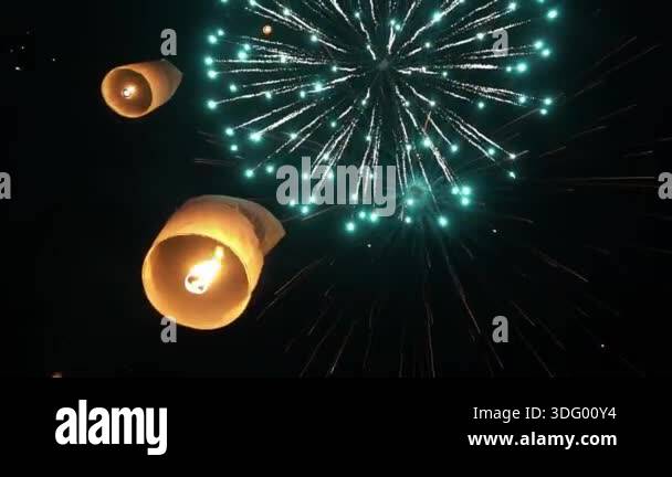 The Chinese lantern flies up and fireworks in sky Stock Video Footage ...
