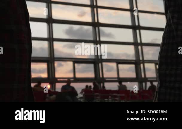 silhouette of two business peoplehandshake in modern lobby hall at ...