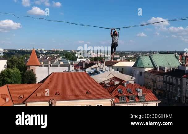 Handsome guy walking on a slackline. Extreme stunt, professional ...