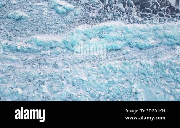 Blue transparent ice with deep cracks, top view of a frozen lake ...