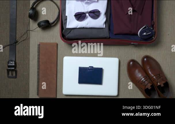 Stop motion. packing a suitcase. Young girl getting ready for travel ...