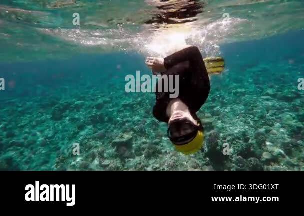 Pretty Free diver playing with jellyfish. Freediving is a sport when a ...