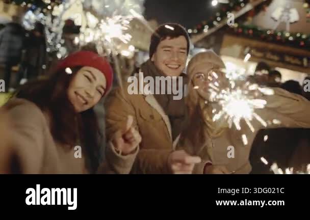 Concept of winter holidays and friendship. Happy women and man having ...