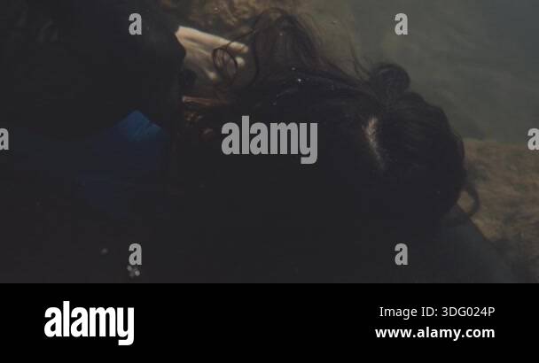 Girl lying underwater, Dramatic concept, filmed on cinematic camera, 12 ...