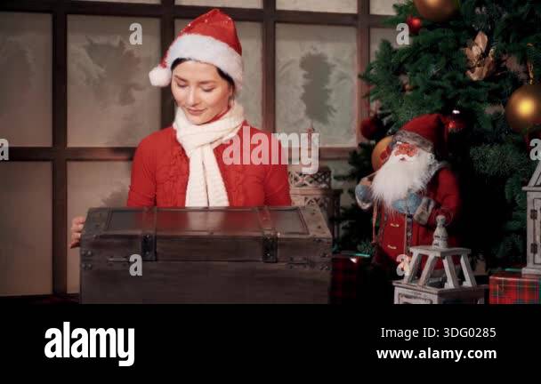 asian girl in hat opening a chest with gifts Stock Video Footage - Alamy