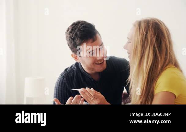 Future parents expecting a baby. Happy young girl surprises her ...