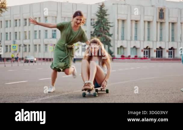 Cool Young Girls Longboards and Skateboards Through Stylish Hip ...