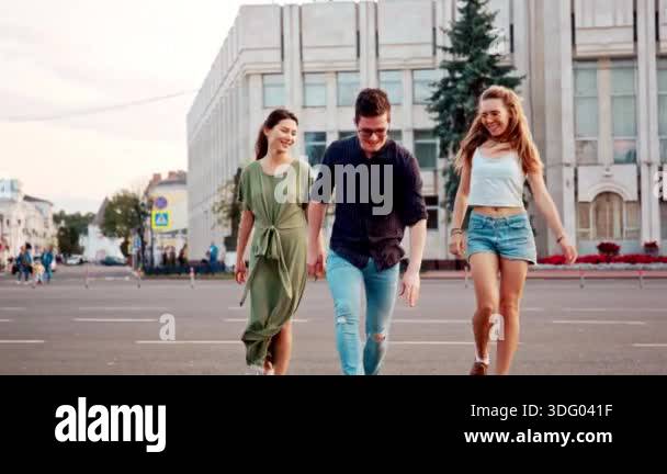 Cool Young Girls and Guy Longboards and Skateboards Through Stylish Hip ...