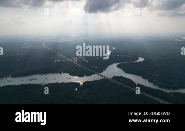 A river is shown in the distance with a bridge in the foreground. The ...