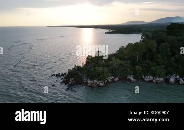 A beautiful ocean view with a mountain in the background. The water is ...