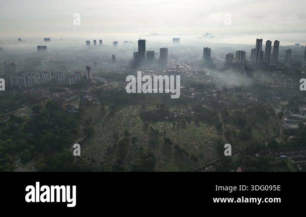 A city with a foggy sky. The sky is gray and the city is full of ...